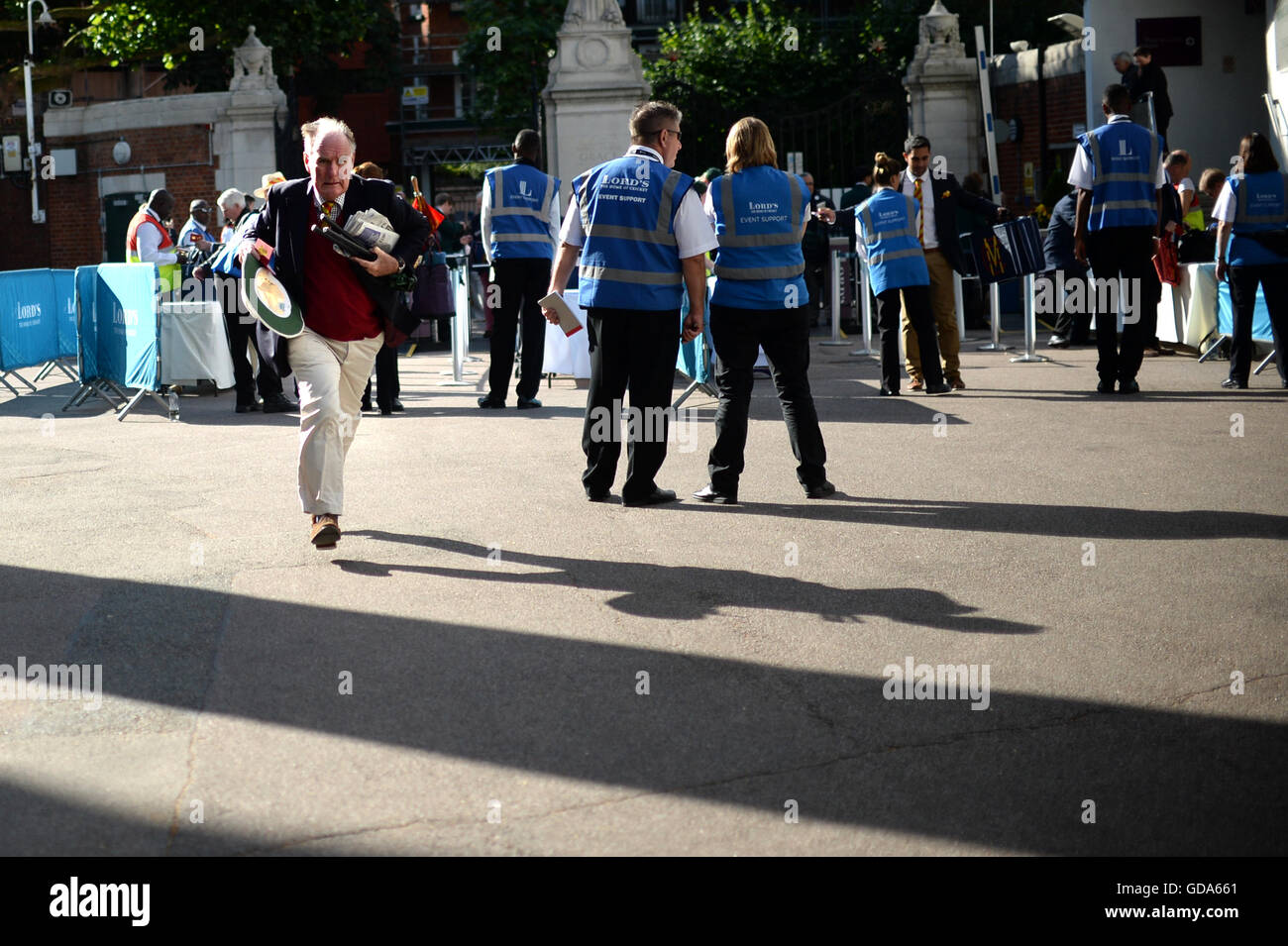 MCC Members run to their seats as they enter Lord's during day one of ...