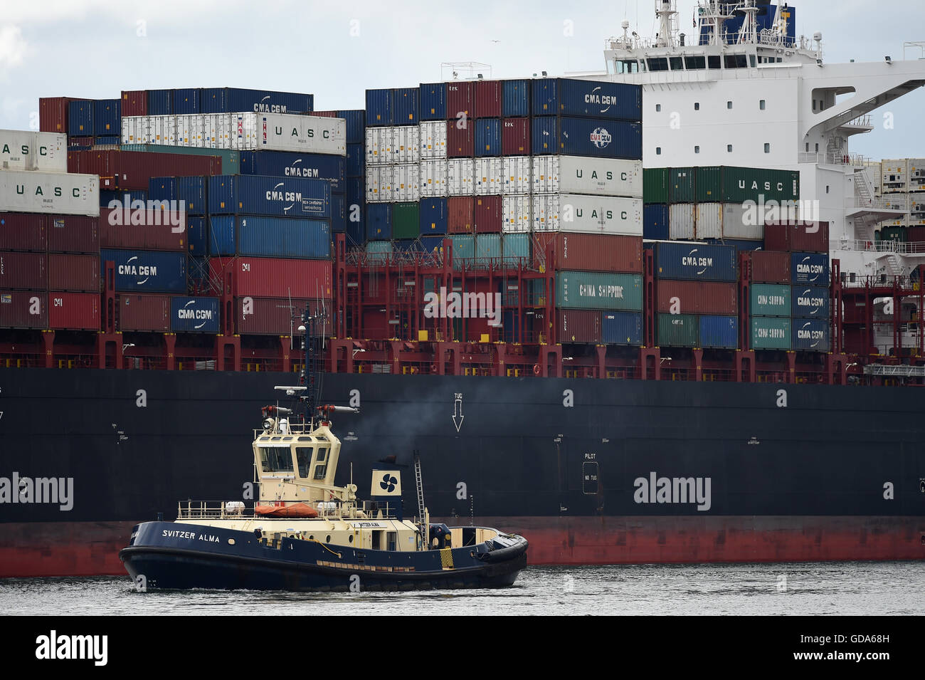 The UASC container ship Al Khor is escorted by a tug boat as she leaves ...