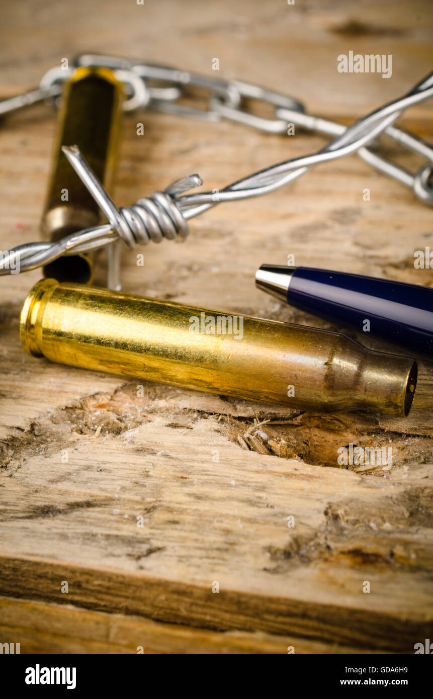 Bullets and barbed wire around a pen, a press freedom concept Stock ...