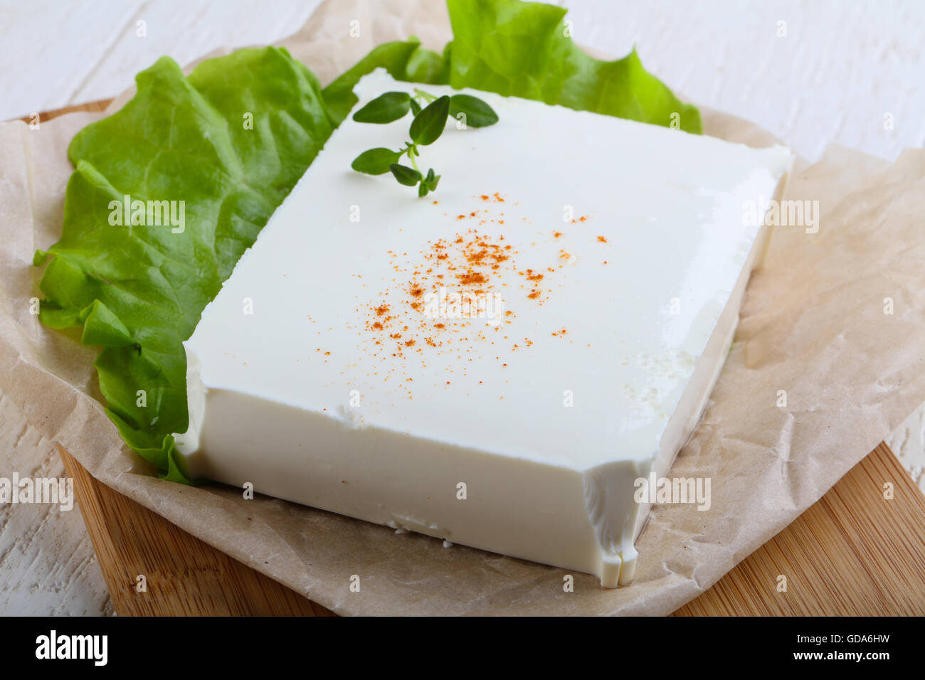 Greek traditional Feta cheese with thyme leaves Stock Photo - Alamy