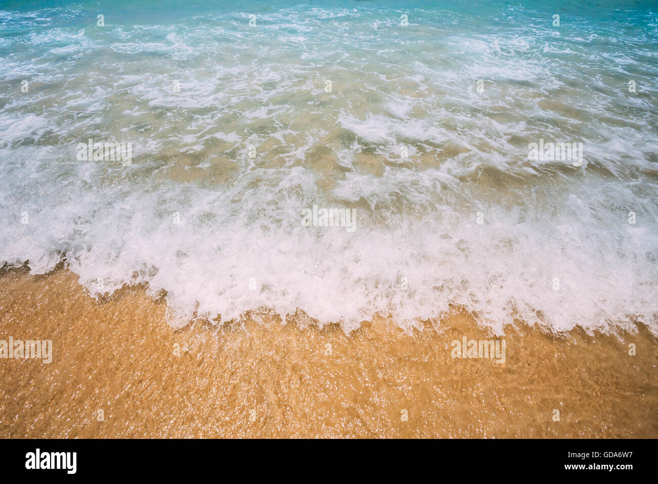 Sea Ocean waves washed yellow sand beach. Background Stock Photo - Alamy