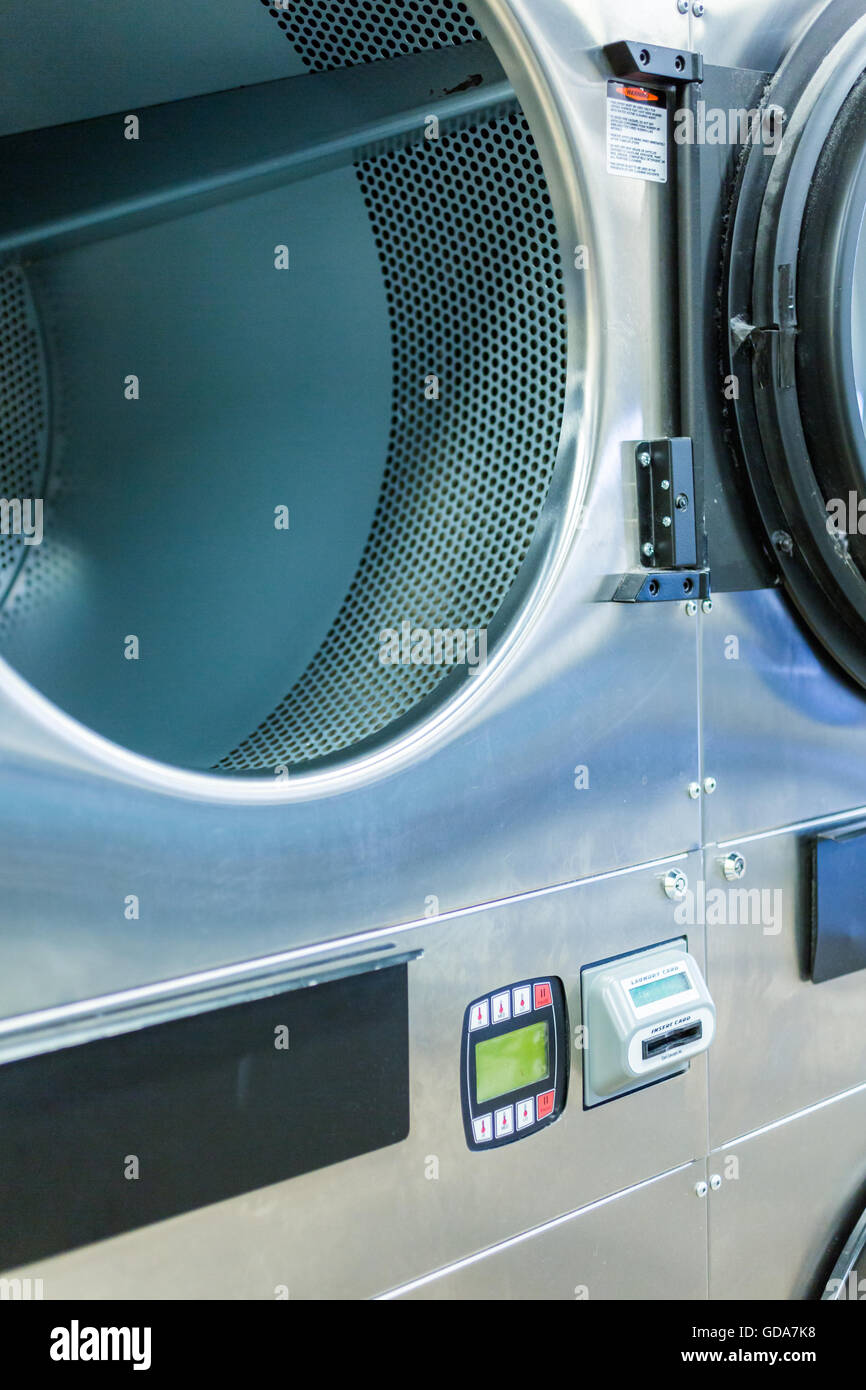 Industrial washing machines in a public laundromat Stock Photo - Alamy