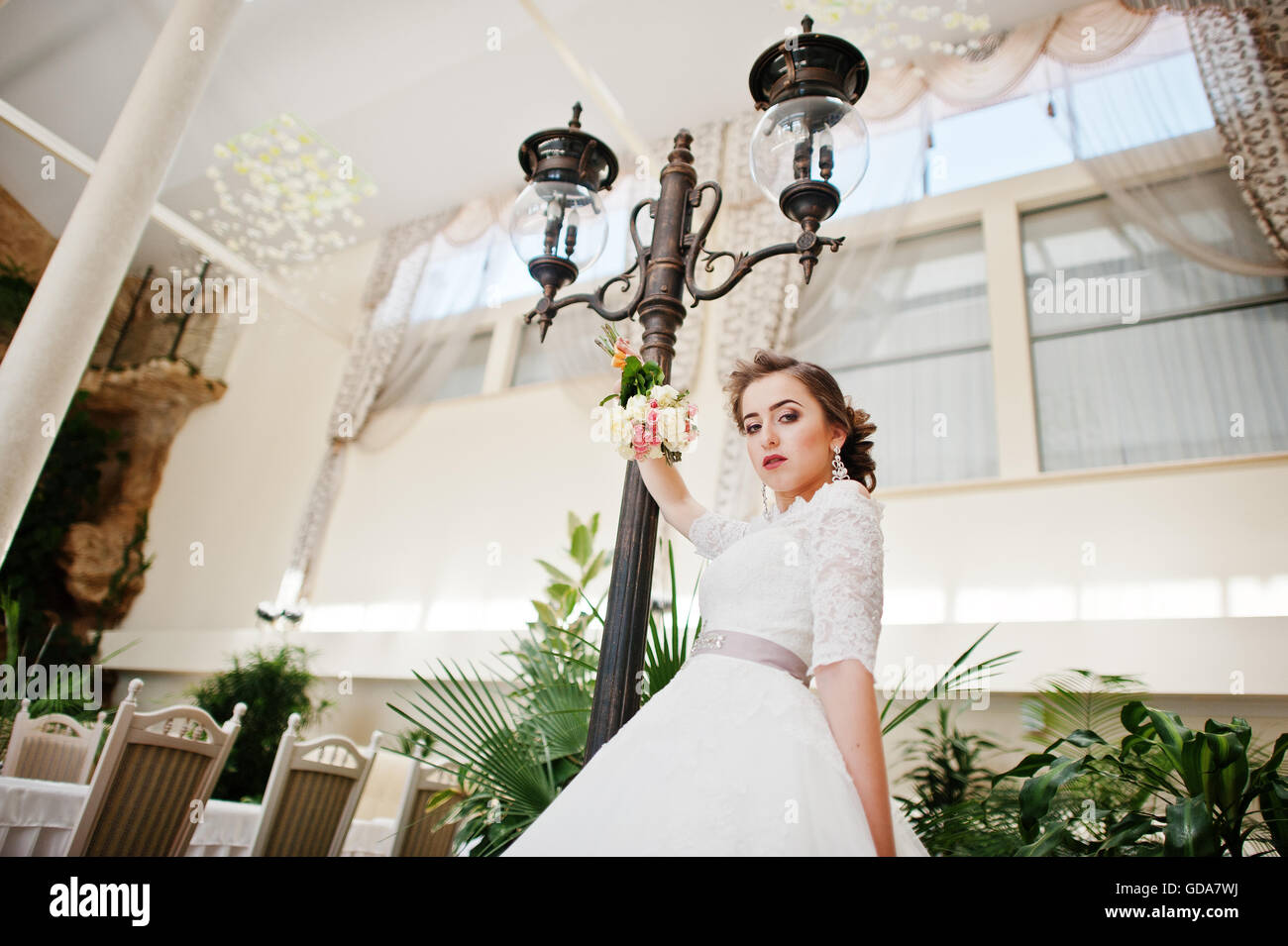Portrait of beautiful bride at wedding hall background lantern Stock ...