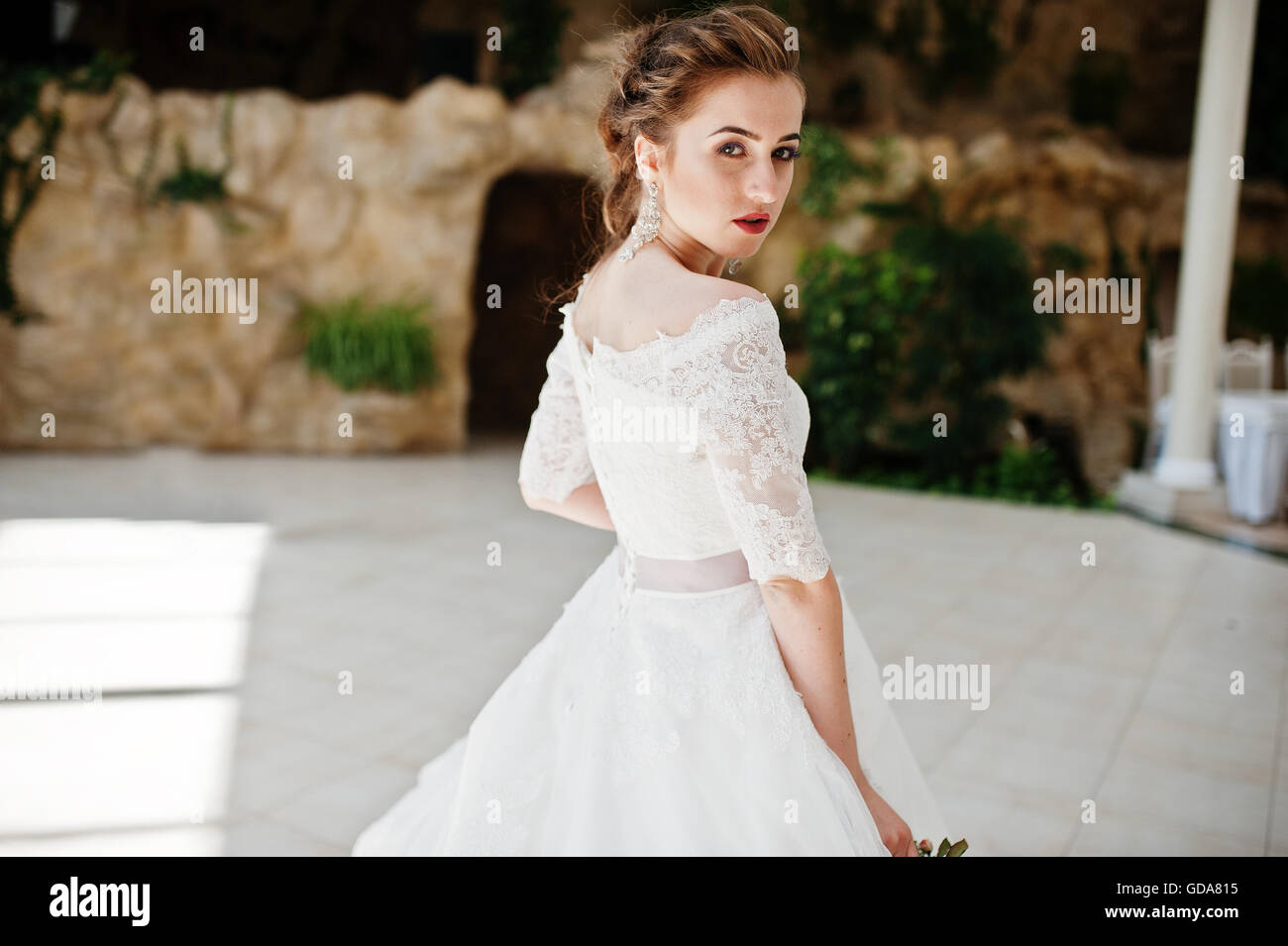Portrait of back of beautiful bride at wedding hall Stock Photo - Alamy