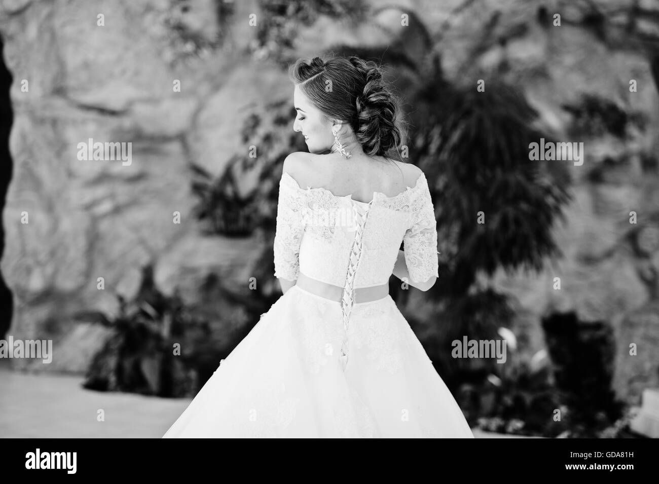 Portrait of back of beautiful bride at wedding hall Stock Photo - Alamy