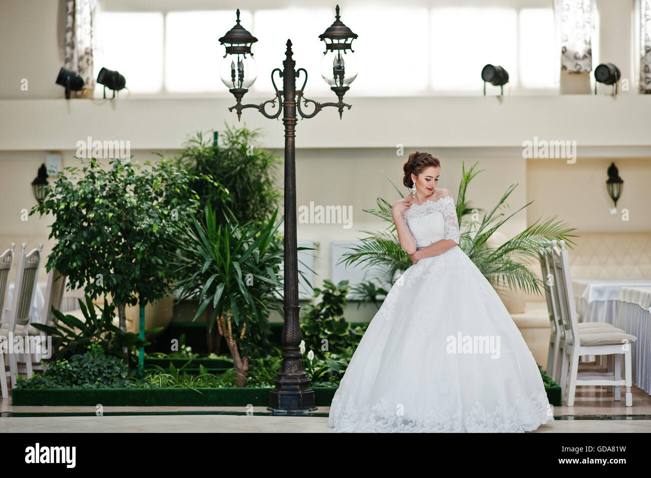 Portrait of beautiful bride at wedding hall background lantern Stock ...