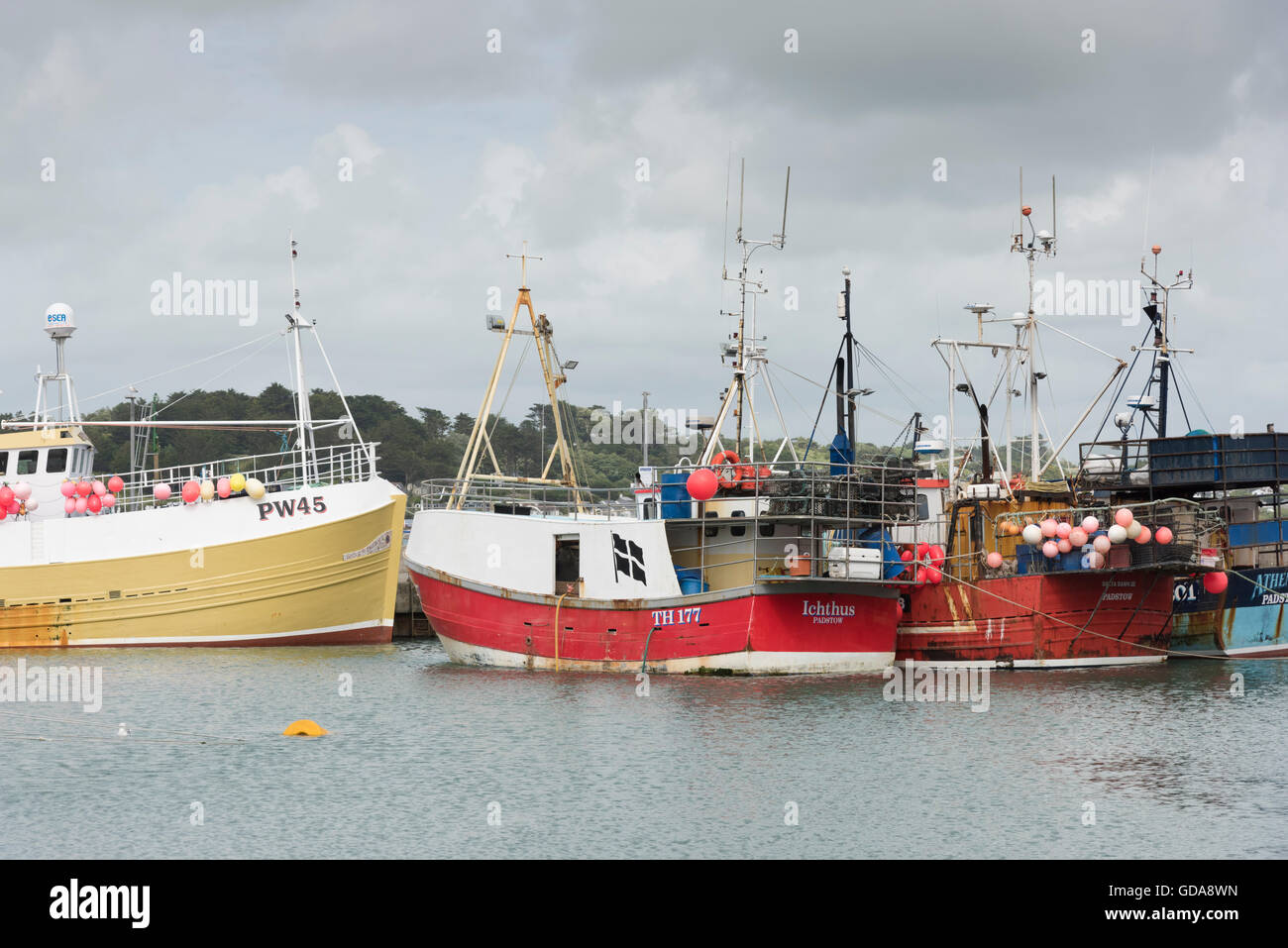 A trawler commercial fishing boat moored in the harbour at Padstow ...