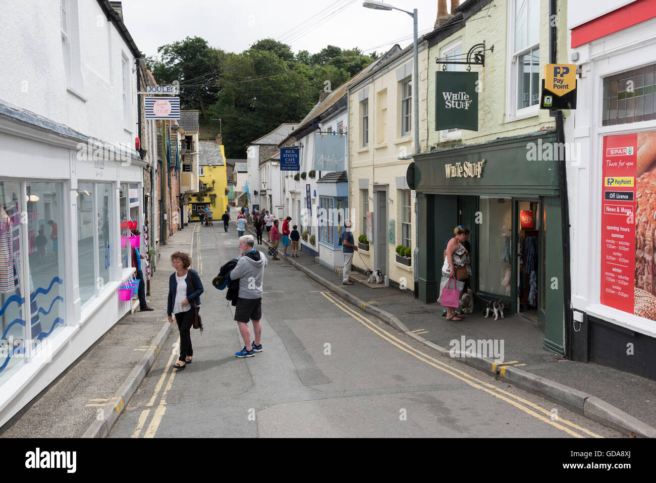 Tourists walking and shopping in Middle Street Padstow Cornwall UK ...