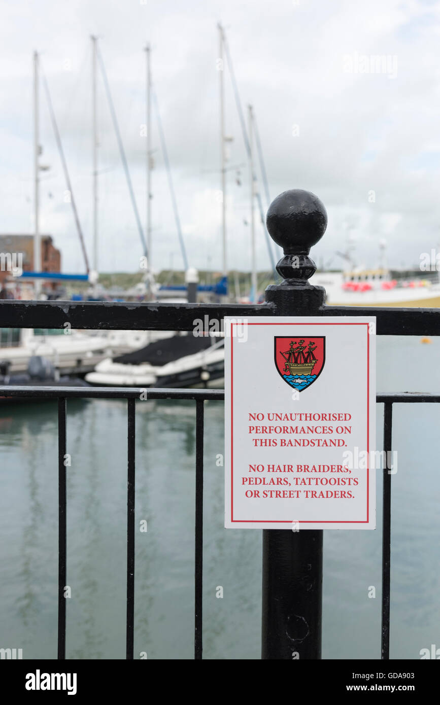 A sign on the harbour at Padstow UK prohibiting busking and street ...
