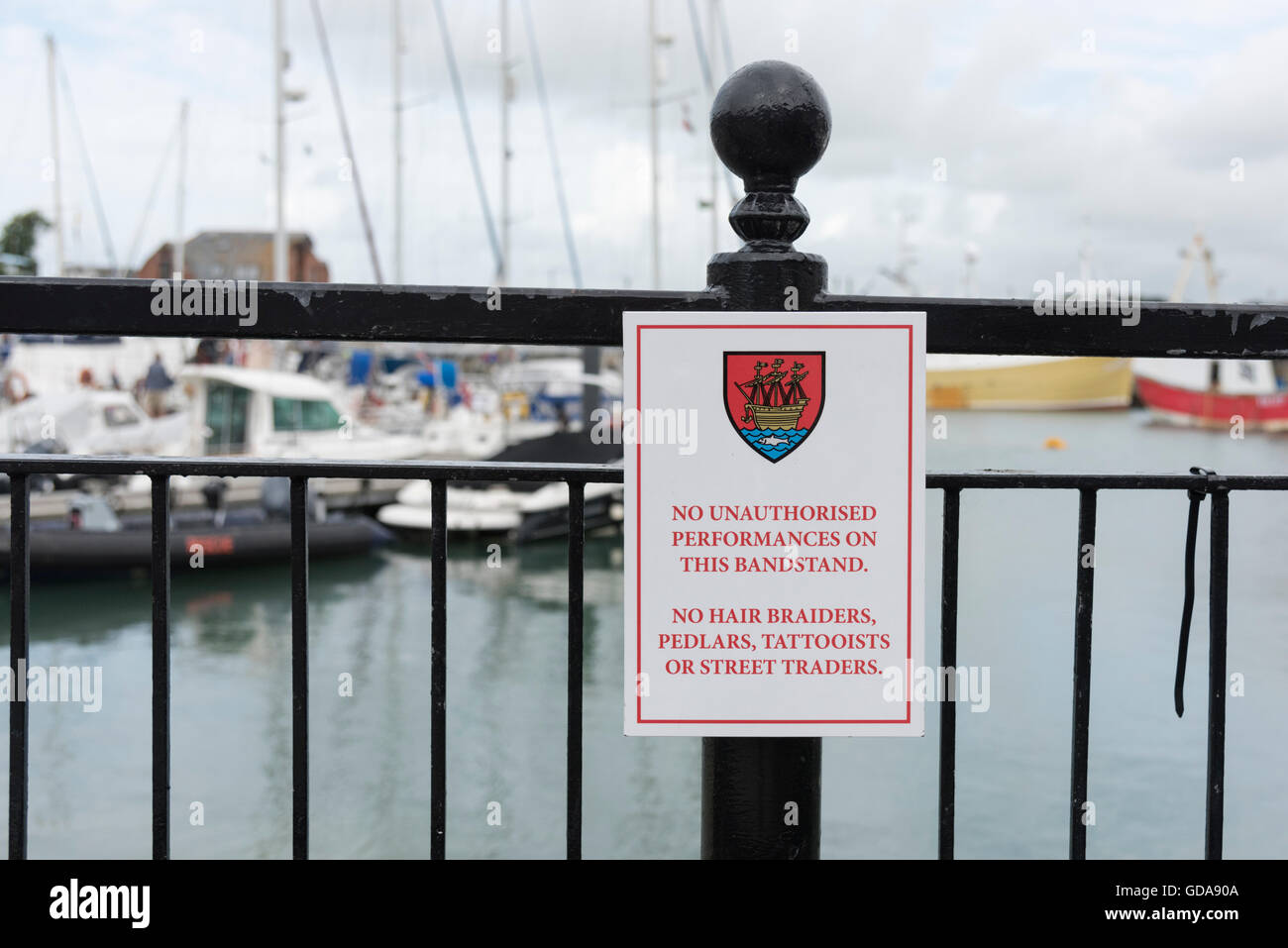 A sign on the harbour at Padstow UK prohibiting busking and street ...