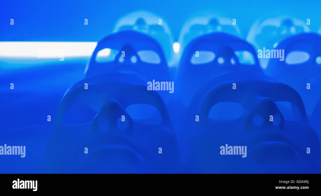 Blue unhappy masks Stock Photo - Alamy