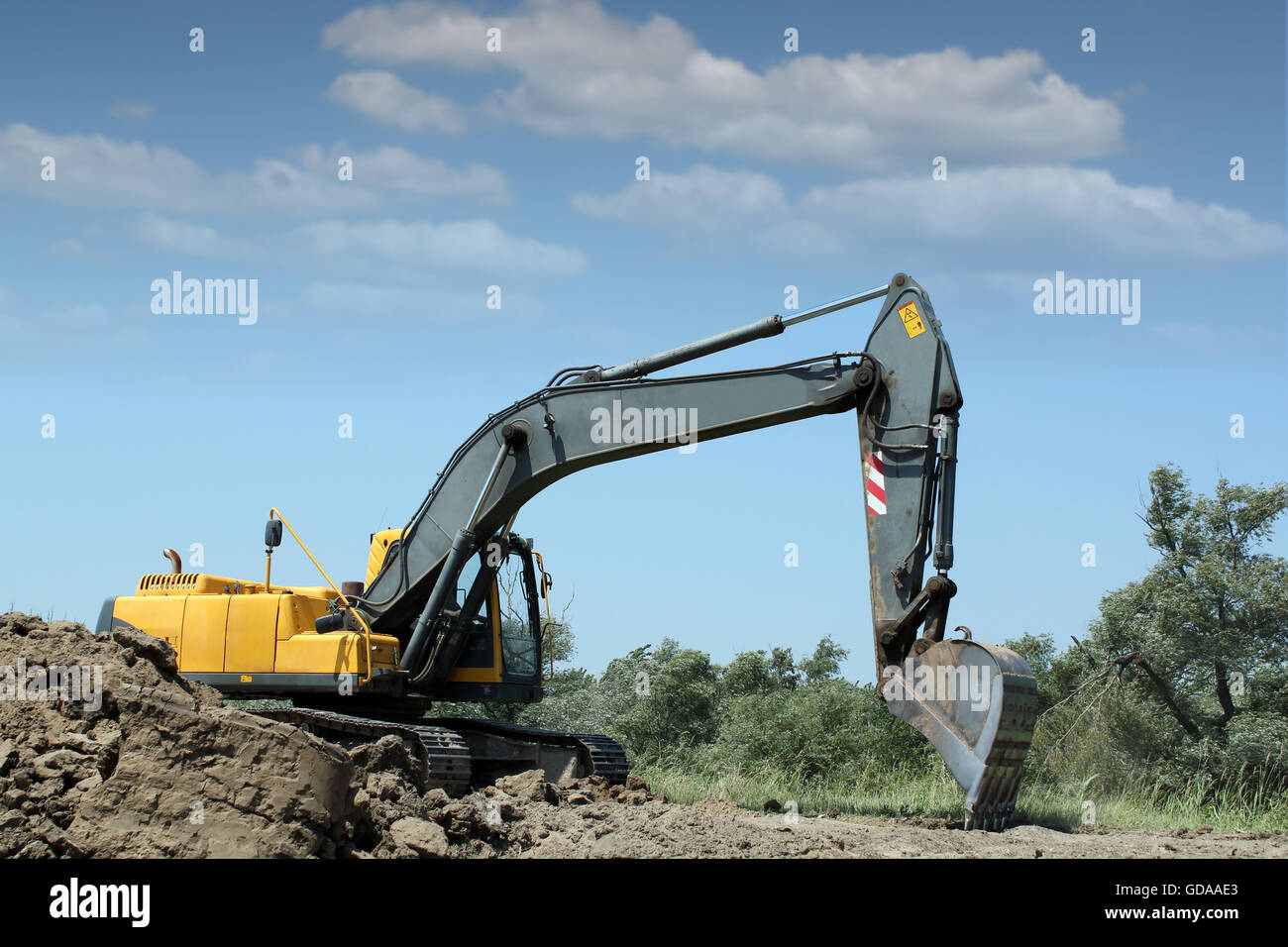 excavator working on road construction Stock Photo - Alamy