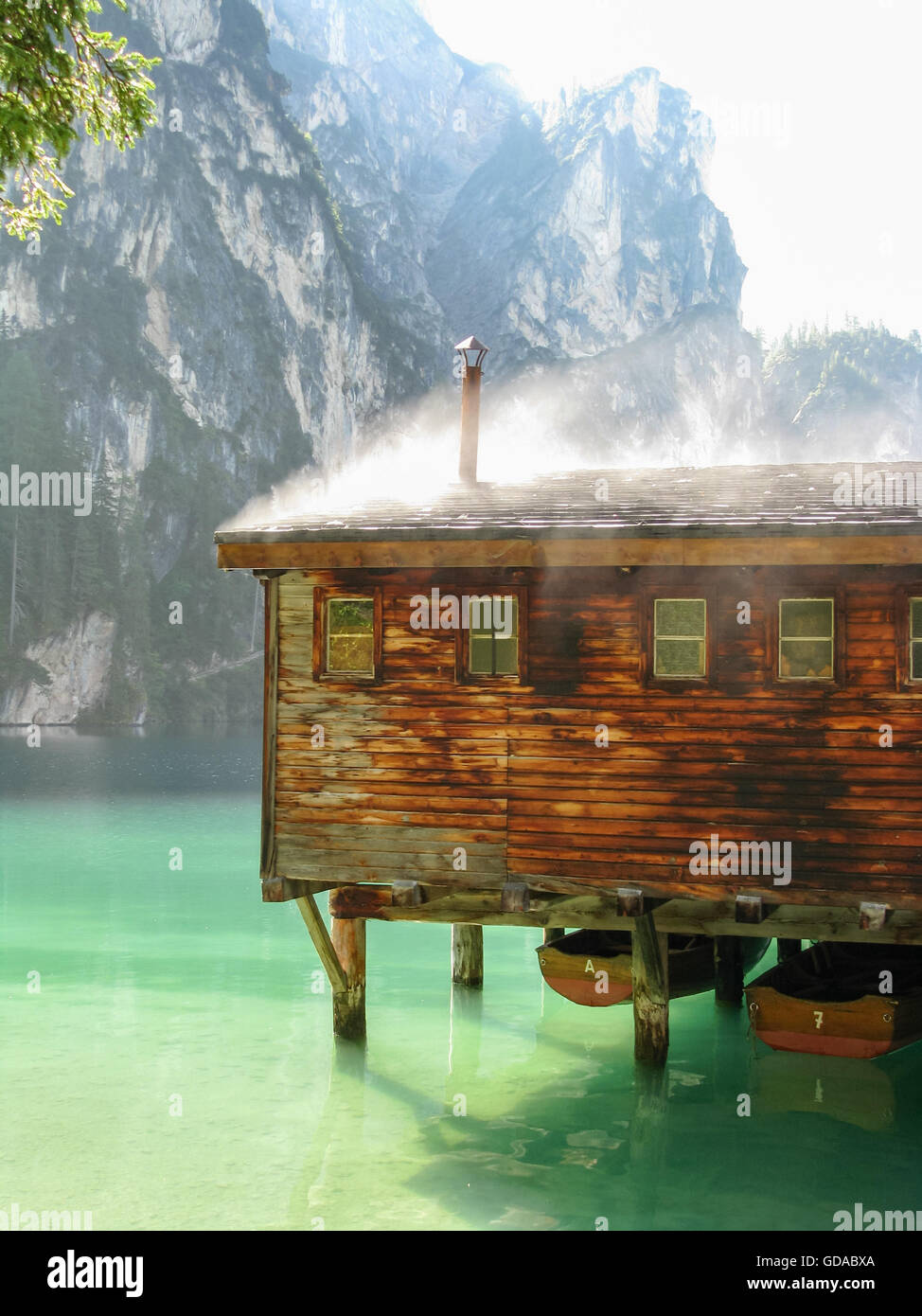 Italy, Trentino-Alto Adige, Bolzano, wooden hut between mountains above ...