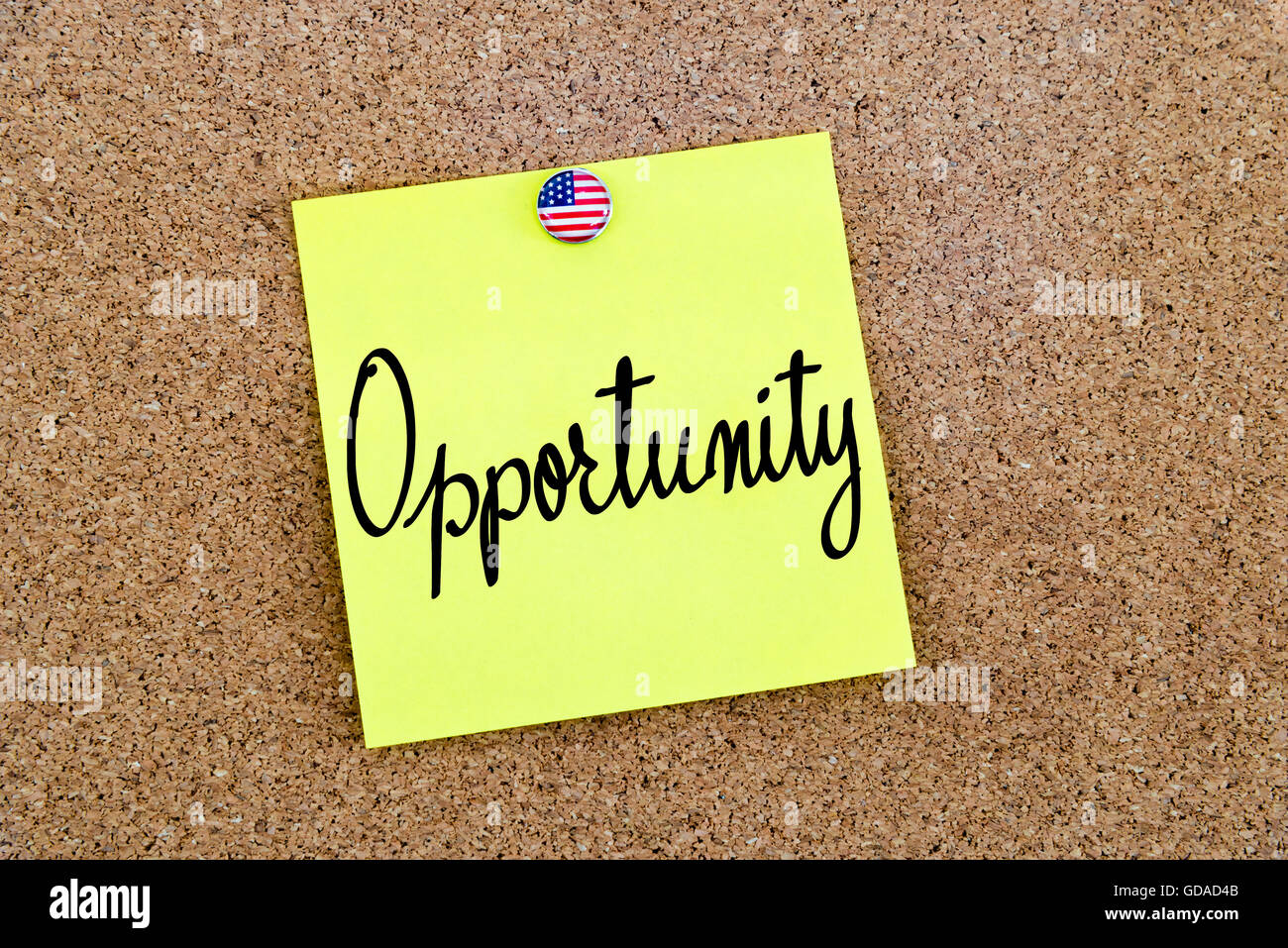Written text Opportunity over yellow paper note pinned on cork board ...