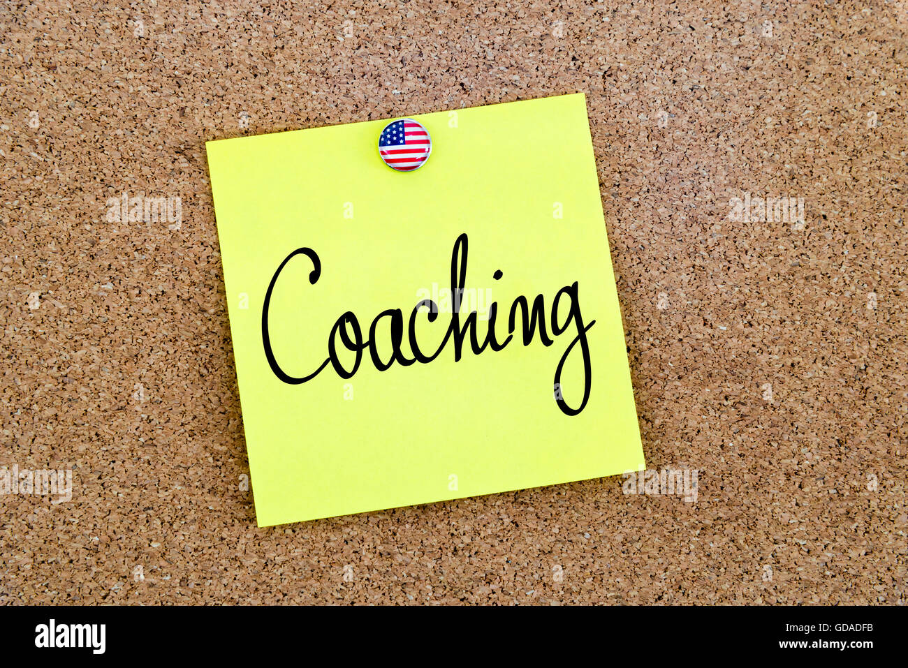 Written text Coaching over yellow paper note pinned on cork board Stock ...