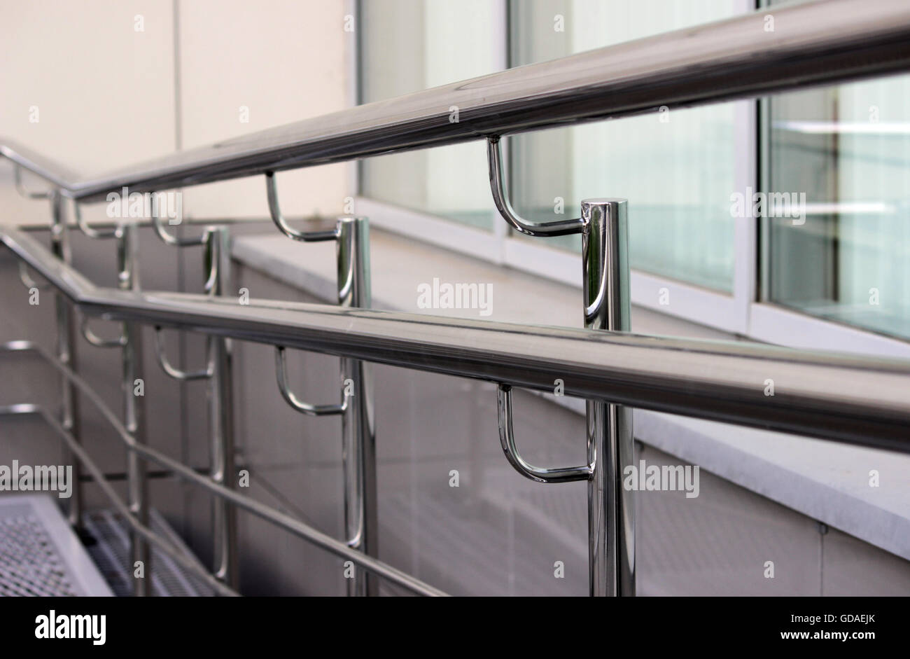 double handrails made of stainless steel in the street Stock Photo - Alamy