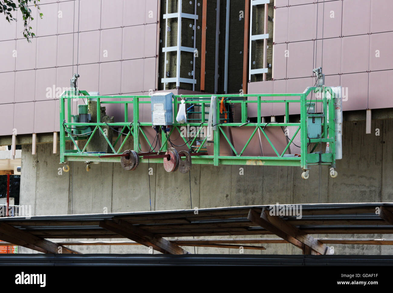 construction suspended cradle without workers on a newly built high ...