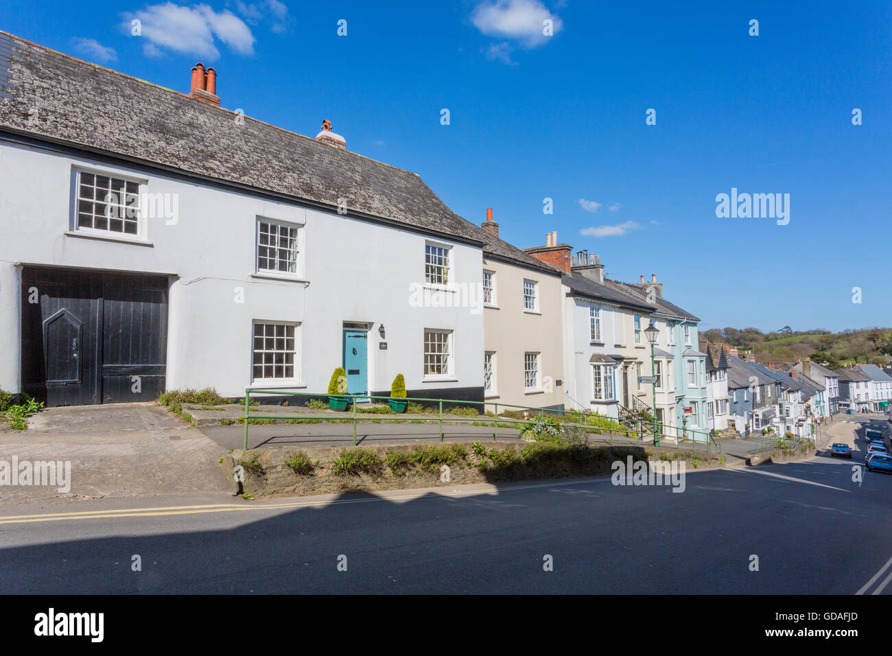 Colourful houses in Church Street, the main road through Modbury, an ...