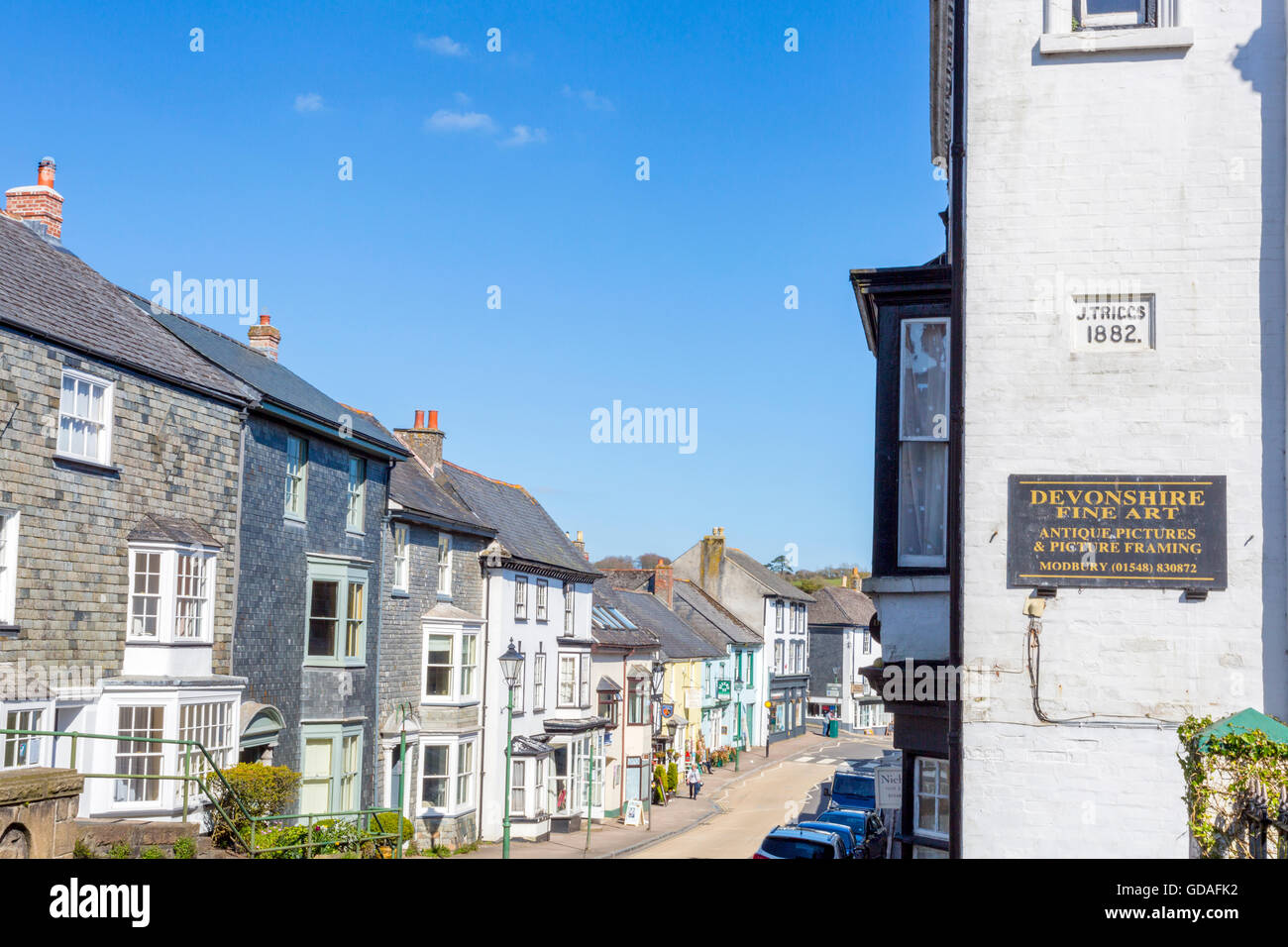 Some of the shops in Church Street, the main road through Modbury, an ...