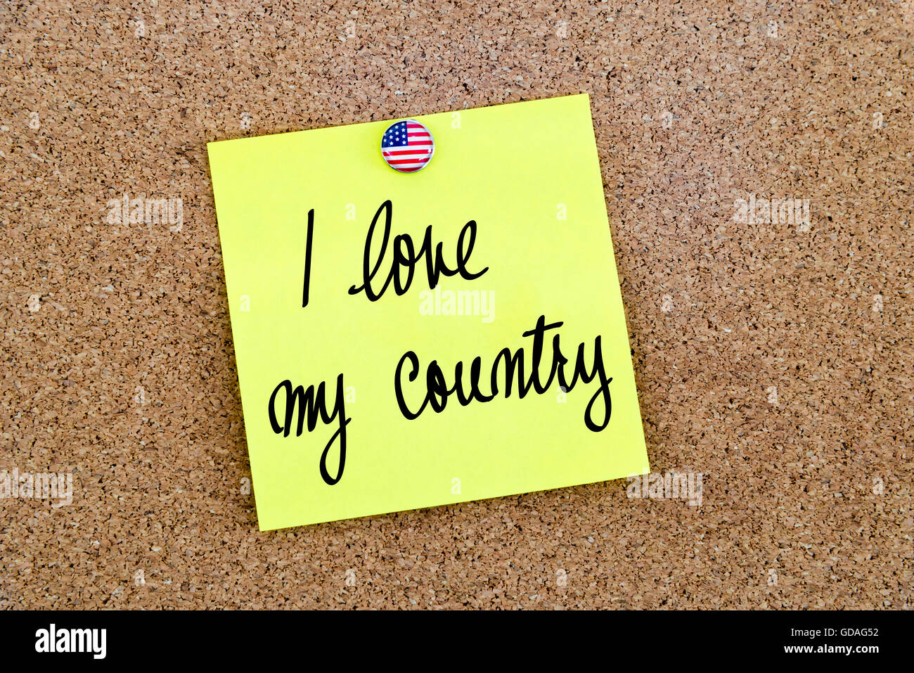 Written text I love My Country over yellow paper note pinned on cork ...
