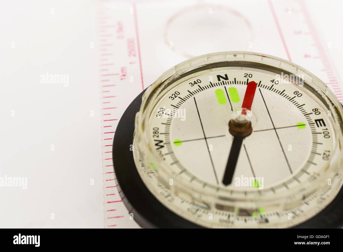 Detail shot of glass compass isolated on white background Stock Photo ...
