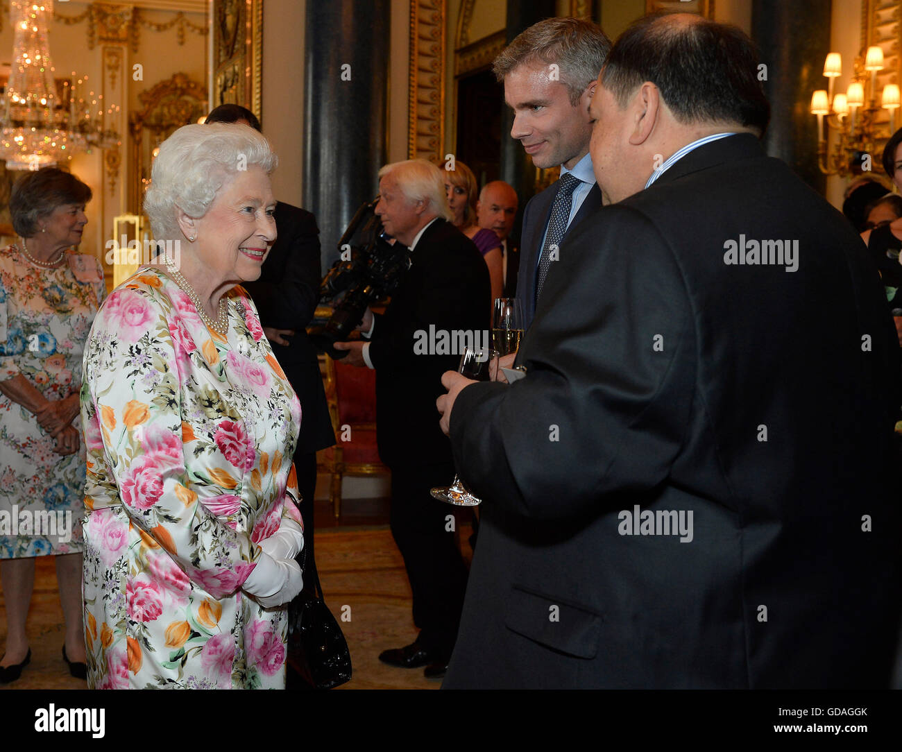 Queen Elizabeth II speaks to guests during a reception for the winners ...