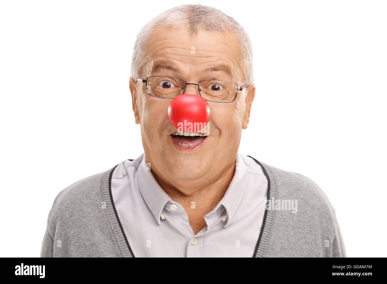 Joyful and funny mature man with a red clown nose isolated on white ...