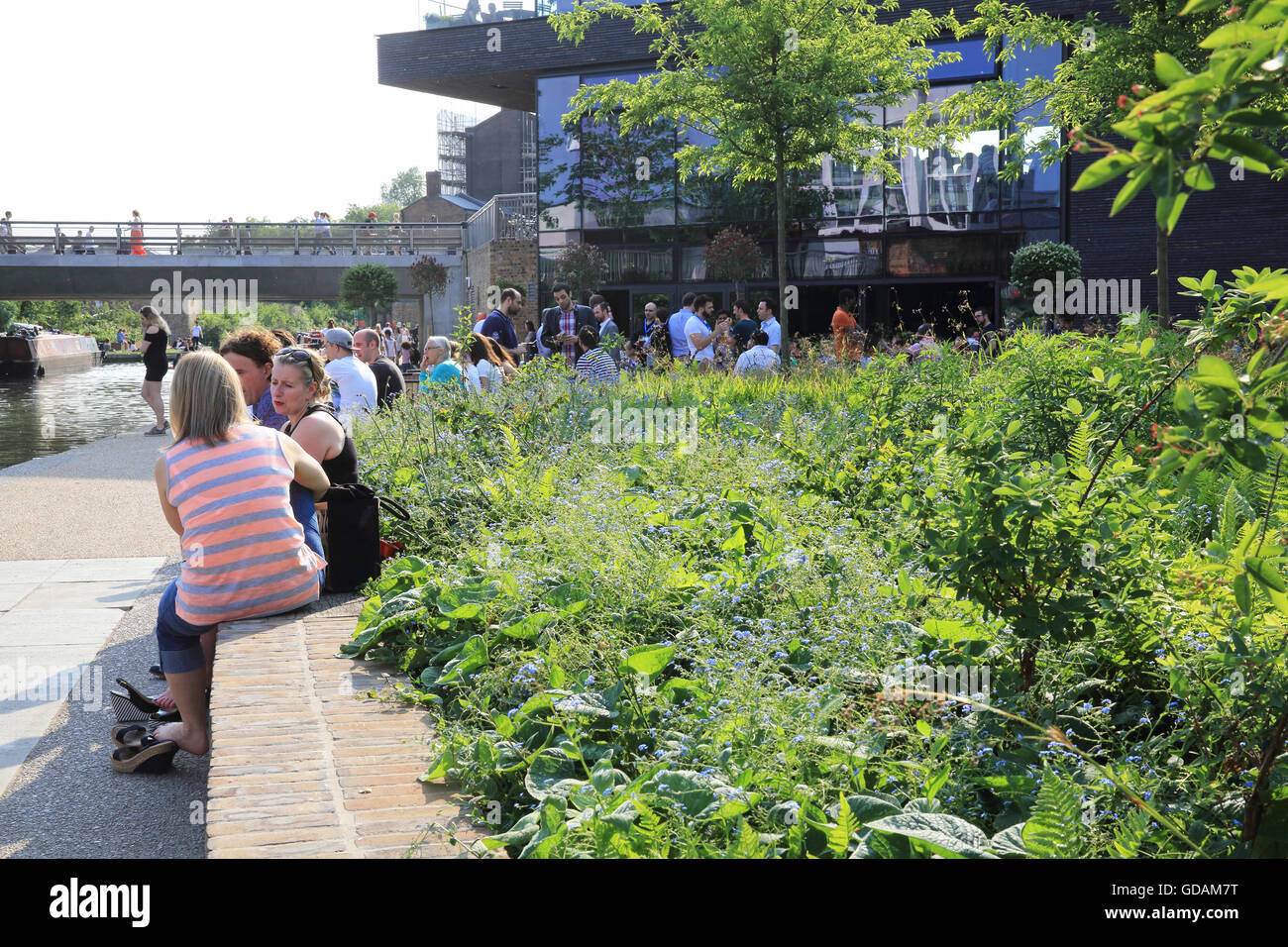 People relaxing at the canal side bar at the Lighterman gastro pub on ...