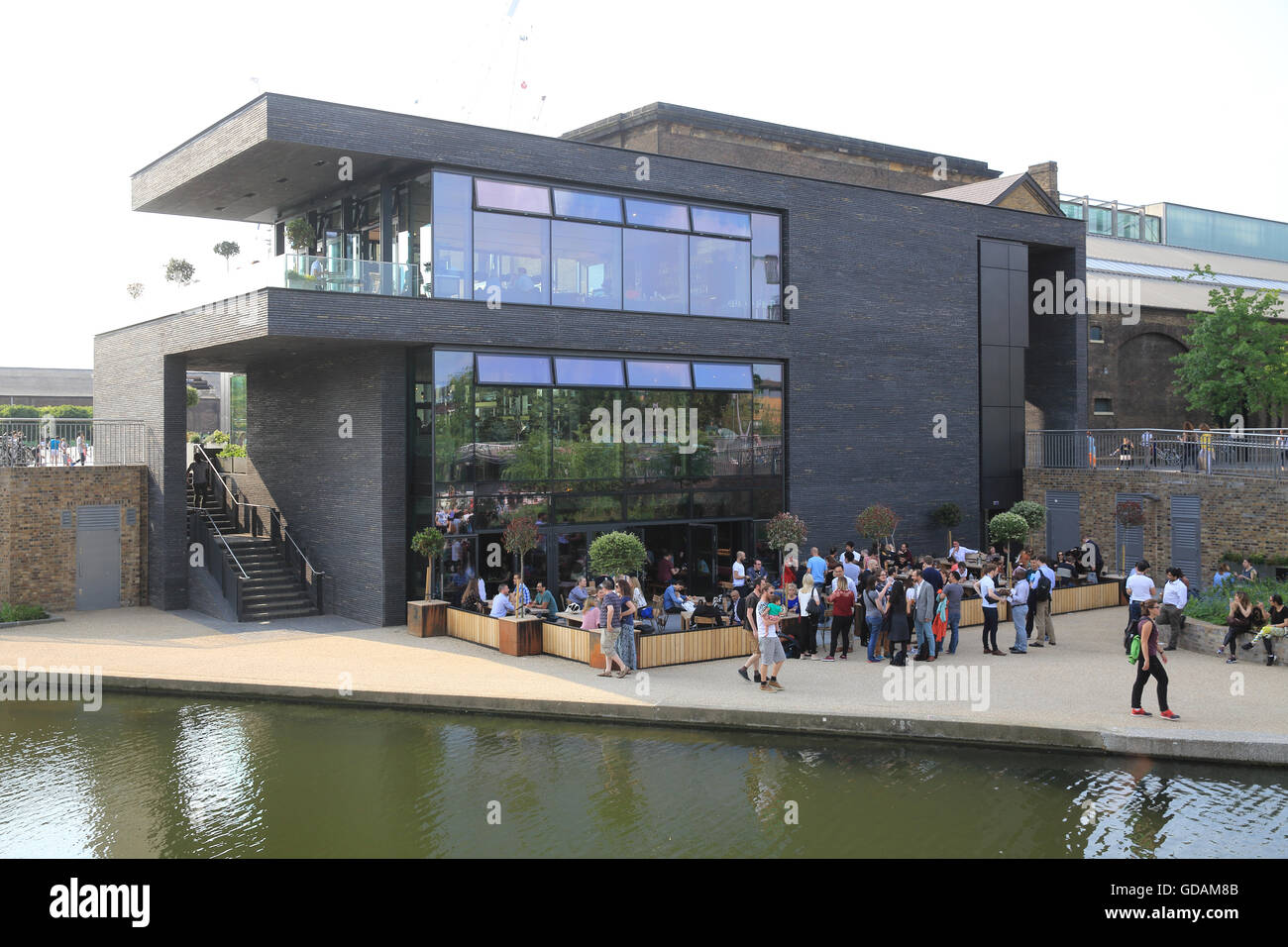 People relaxing at the canal side bar at the Lighterman gastro pub on ...