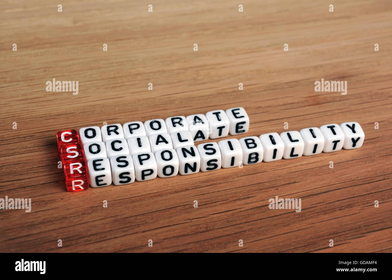 CSR Corporate Social Responsibility acronym on cubes on wood Stock ...