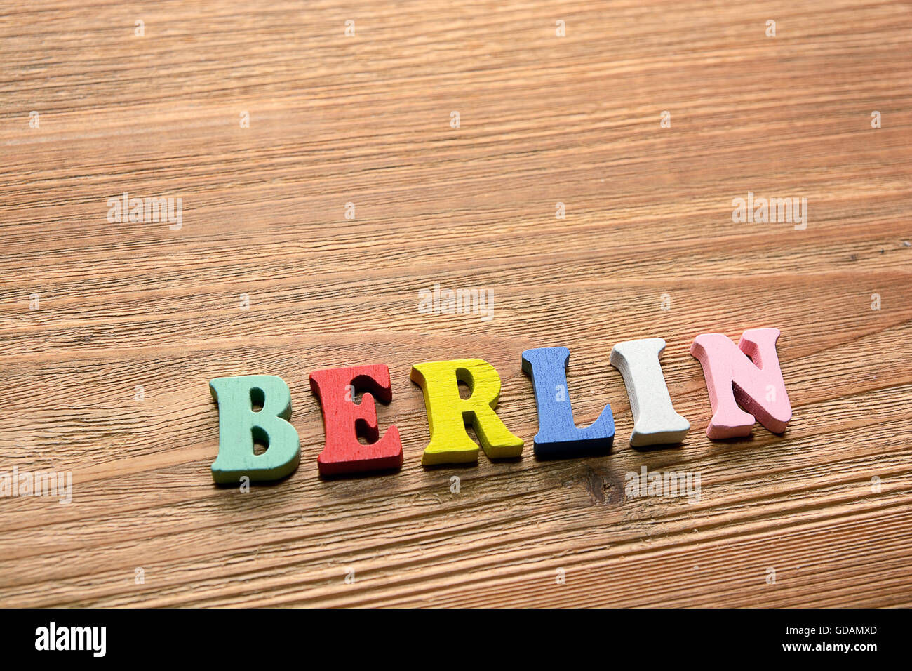 BERLIN - words made from multicolored letters on wooden background ...