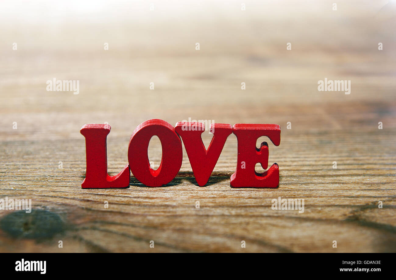 LOVE- word made from red letters on wooden background Stock Photo - Alamy