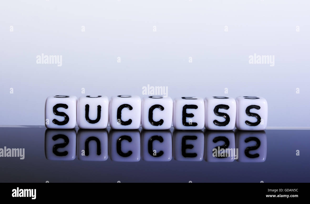 Success text written on cubes on white background Stock Photo - Alamy