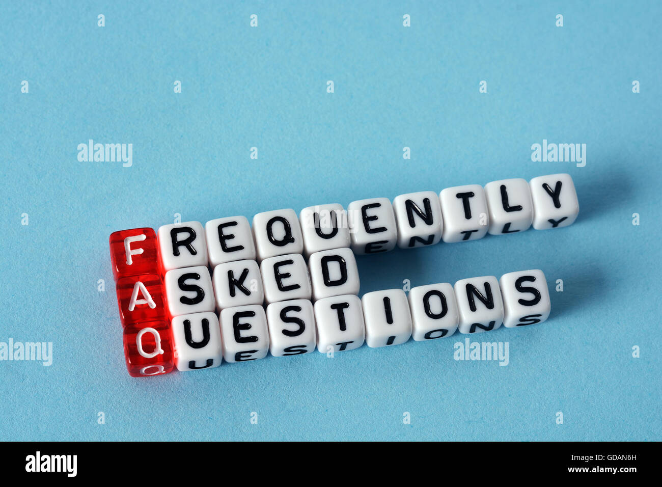 FAQ Frequently Asked Questions written on cubes on blue background ...