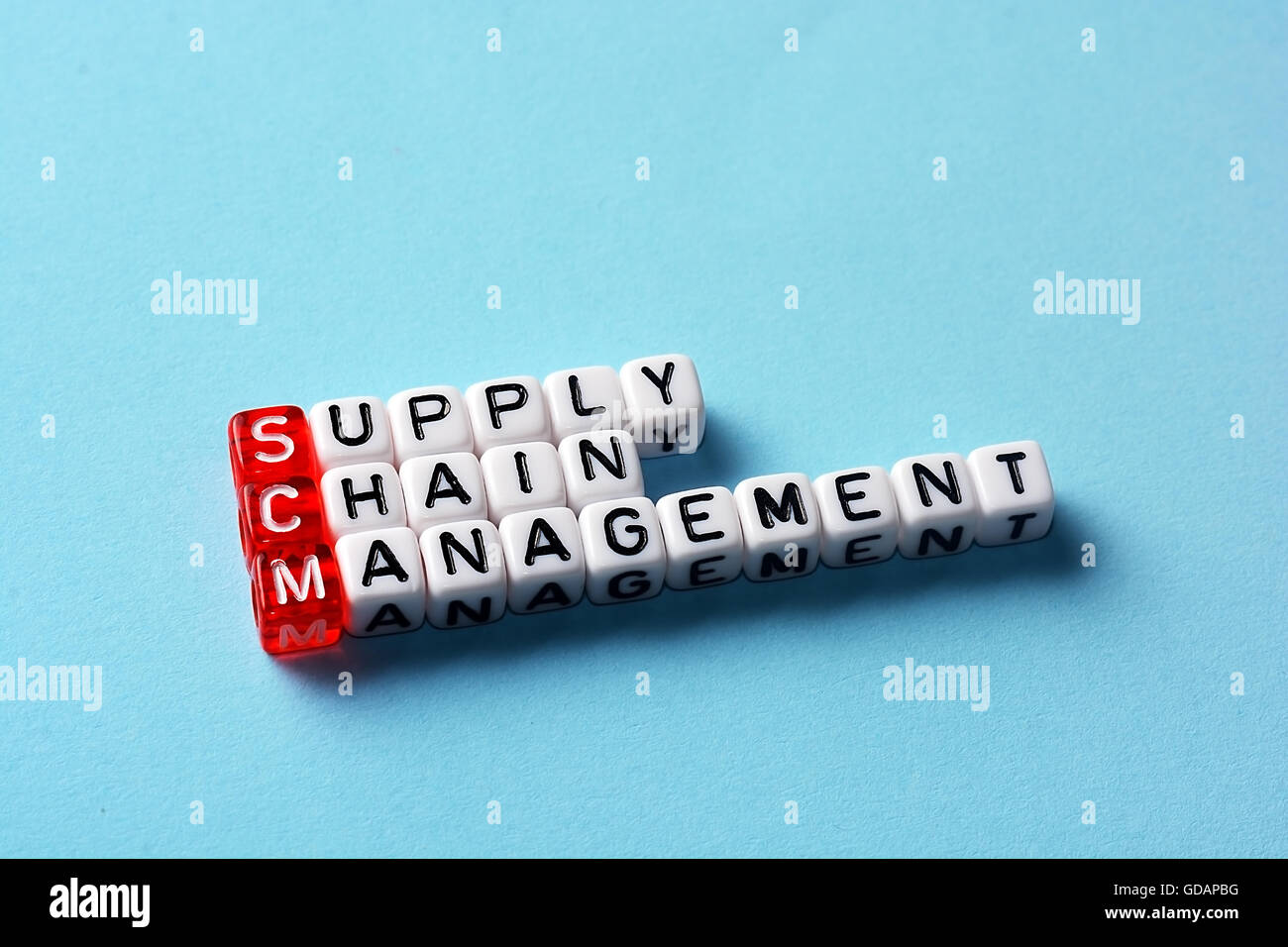 SCM Supply Chain Management written on dices on blue background Stock ...