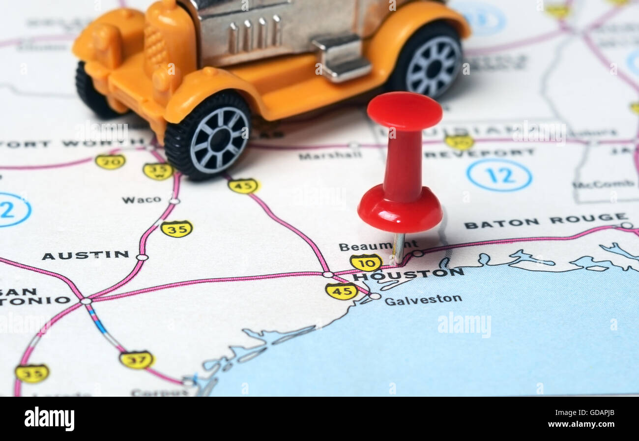 Close up of Houston USA map with red pin and retro car toy - Travel ...