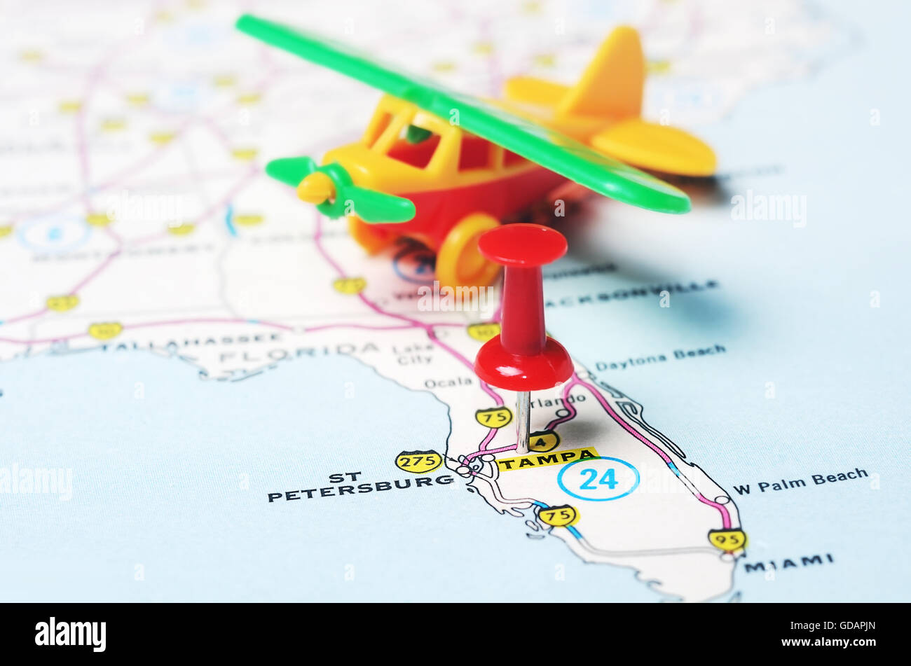 Close up of Tampa Florida USA map with red pin and airplane toy ...