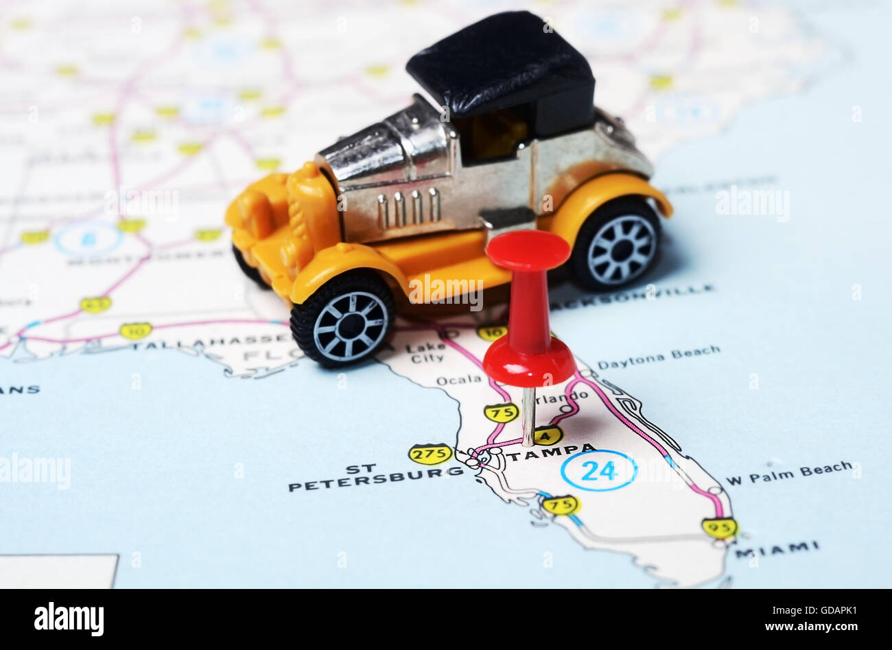 Close up of Tampa Florida USA map with red pin and retro car toy ...