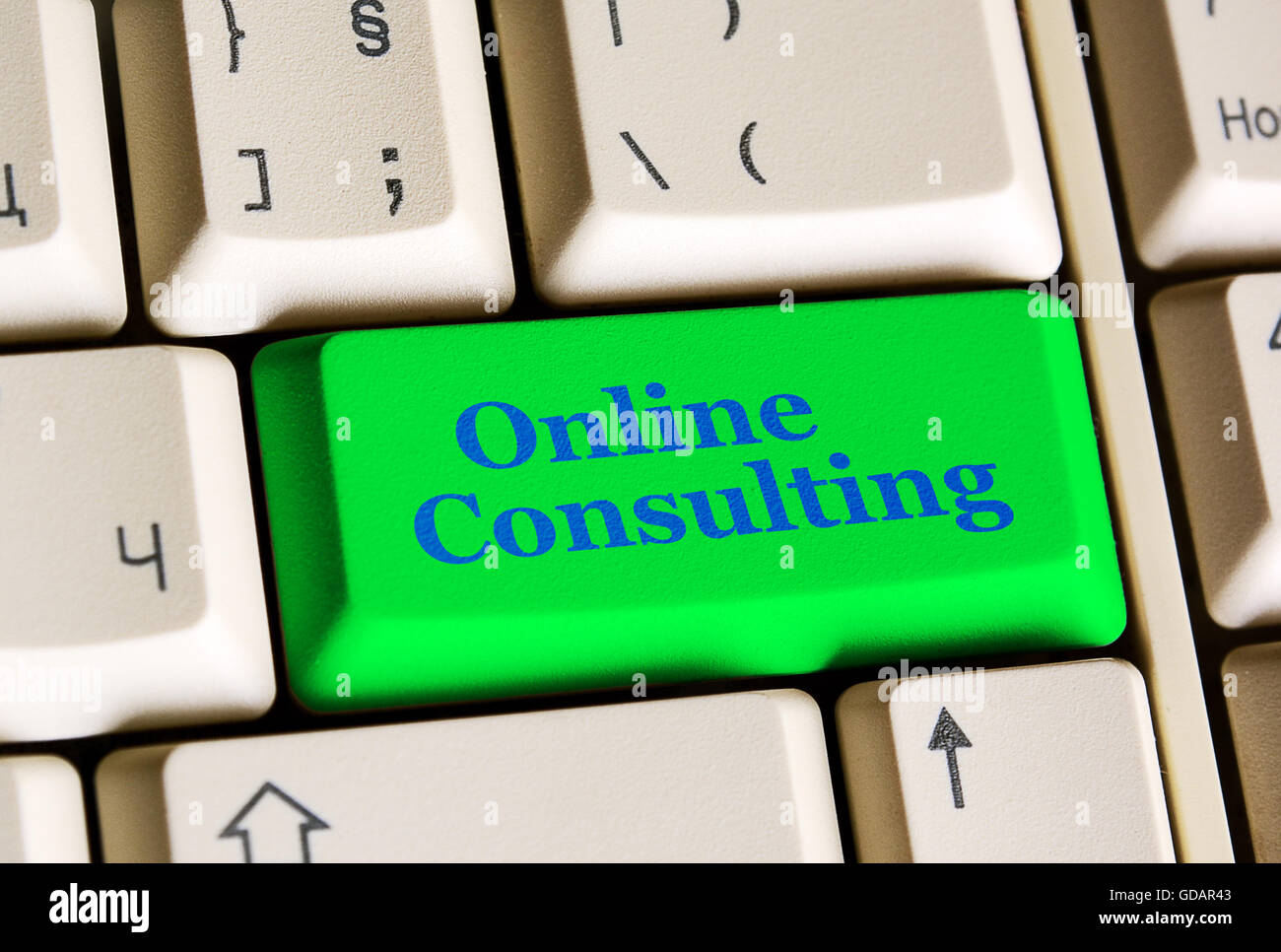 Green online consulting button on white keyboard Stock Photo - Alamy