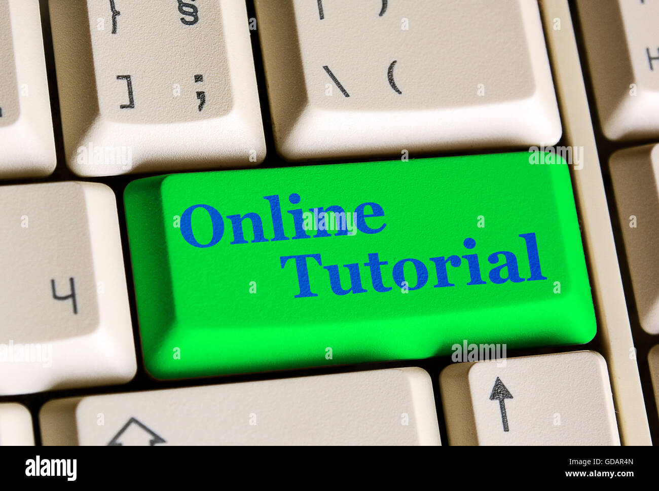 Education concept: Written word Online Tutorial on green keyboard ...