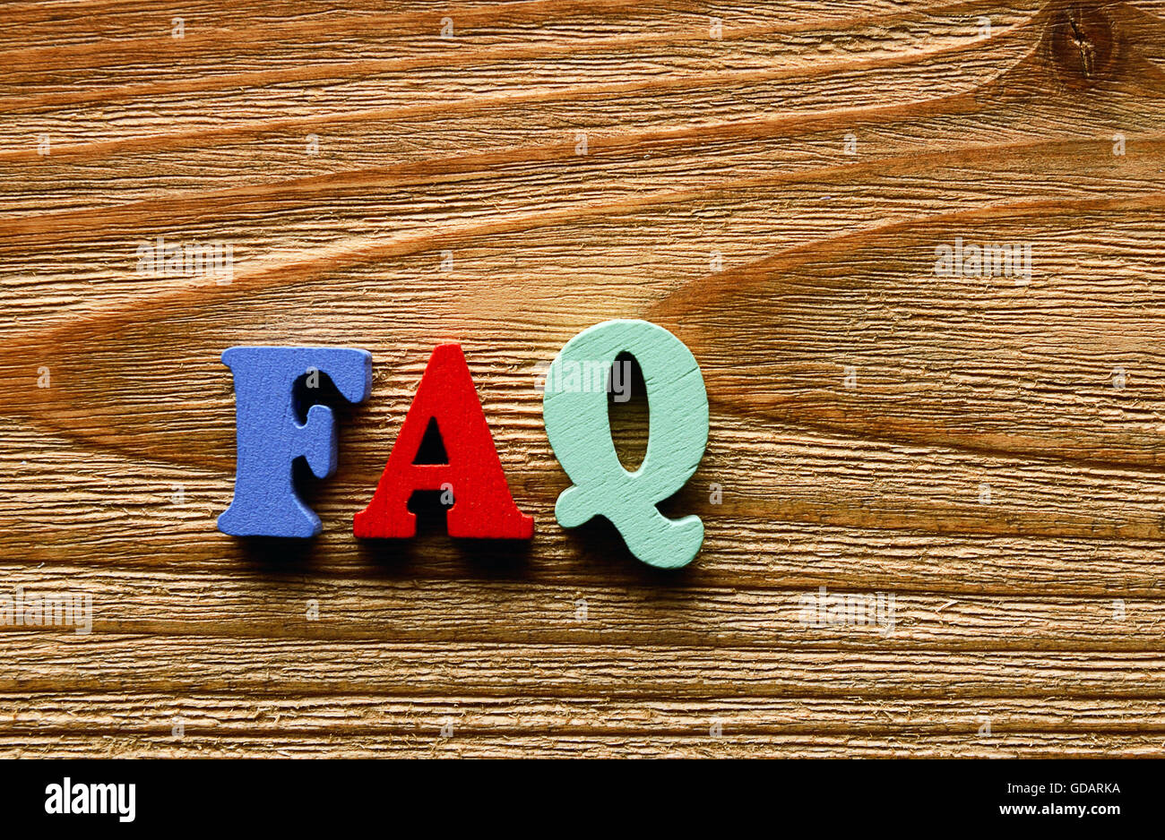 FAQ- words made from multicolored letters on wooden background Stock ...