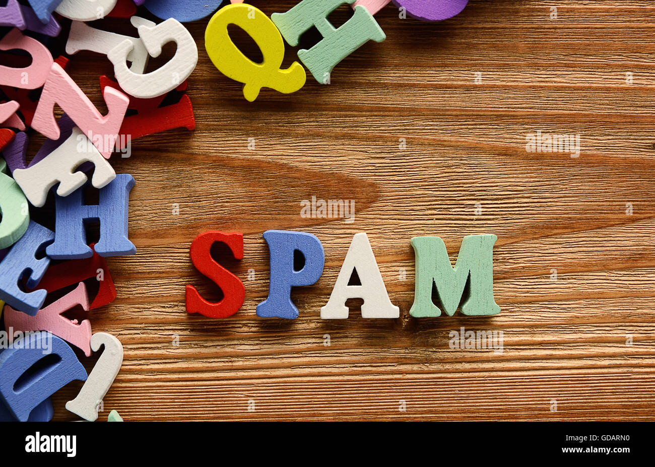 SPAM - words made from multicolored letters on wooden background Stock ...