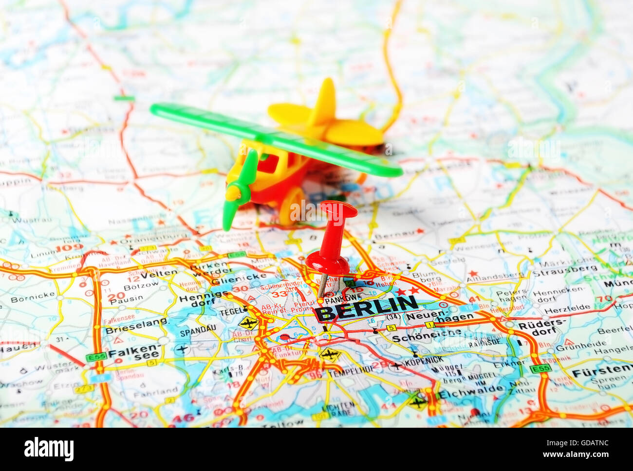 Close up of Berlin map with red pin and airplane toy - Travel concept ...
