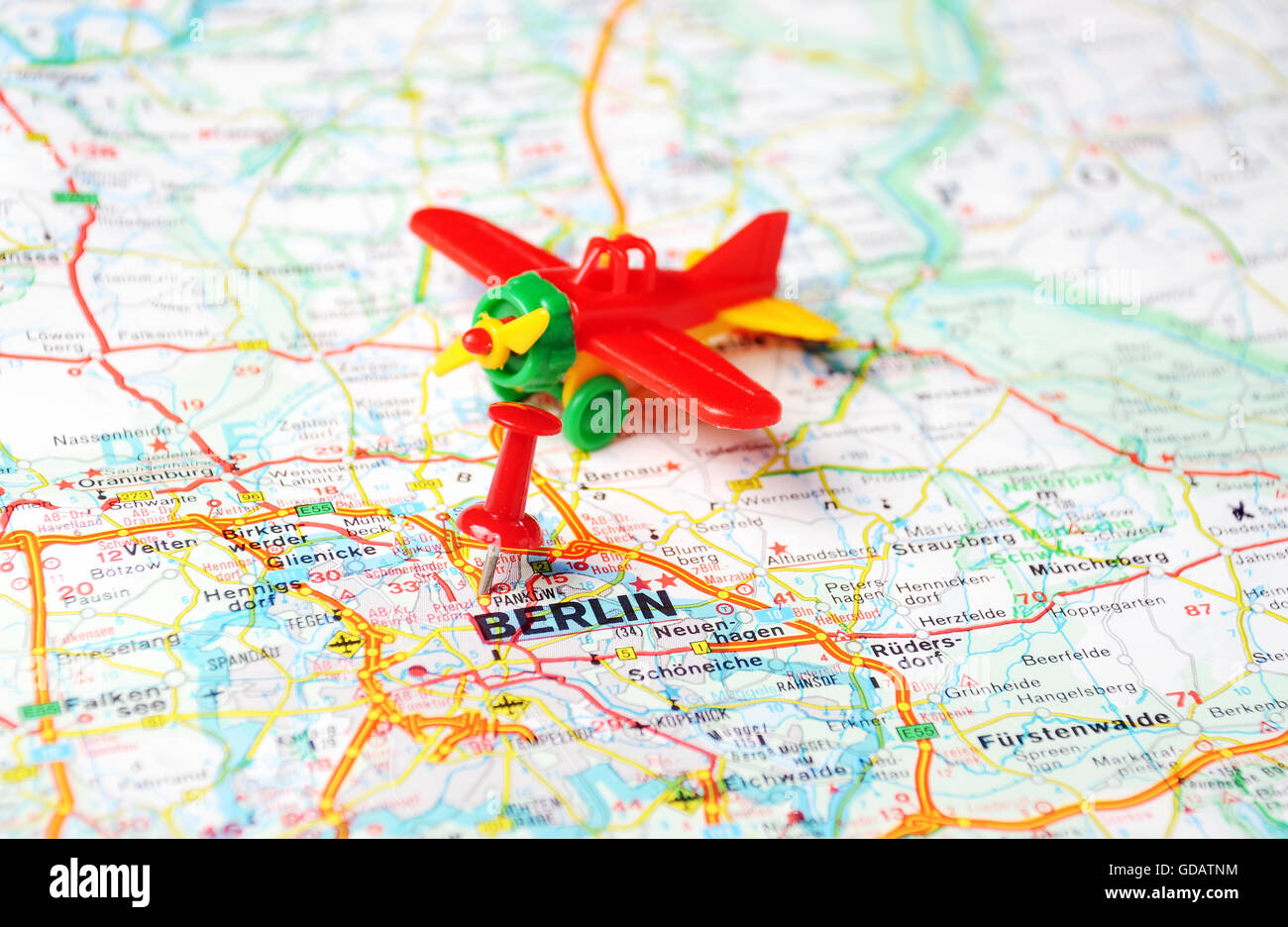 Close up of Berlin map with red pin and airplane toy - Travel concept ...