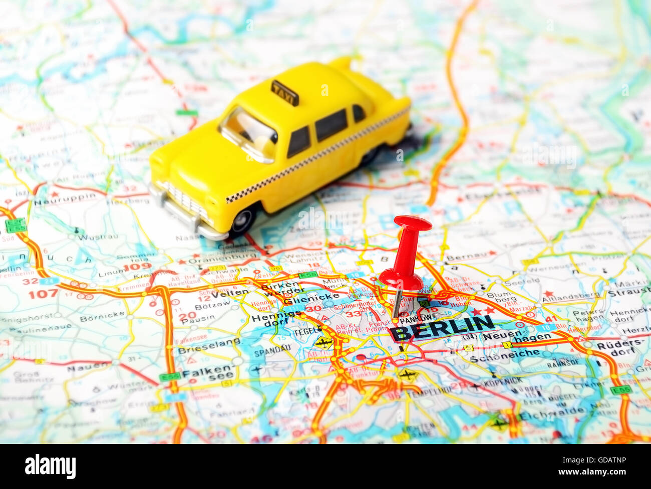 Close up of Berlin map with red pin and a taxi toy - Travel concept ...