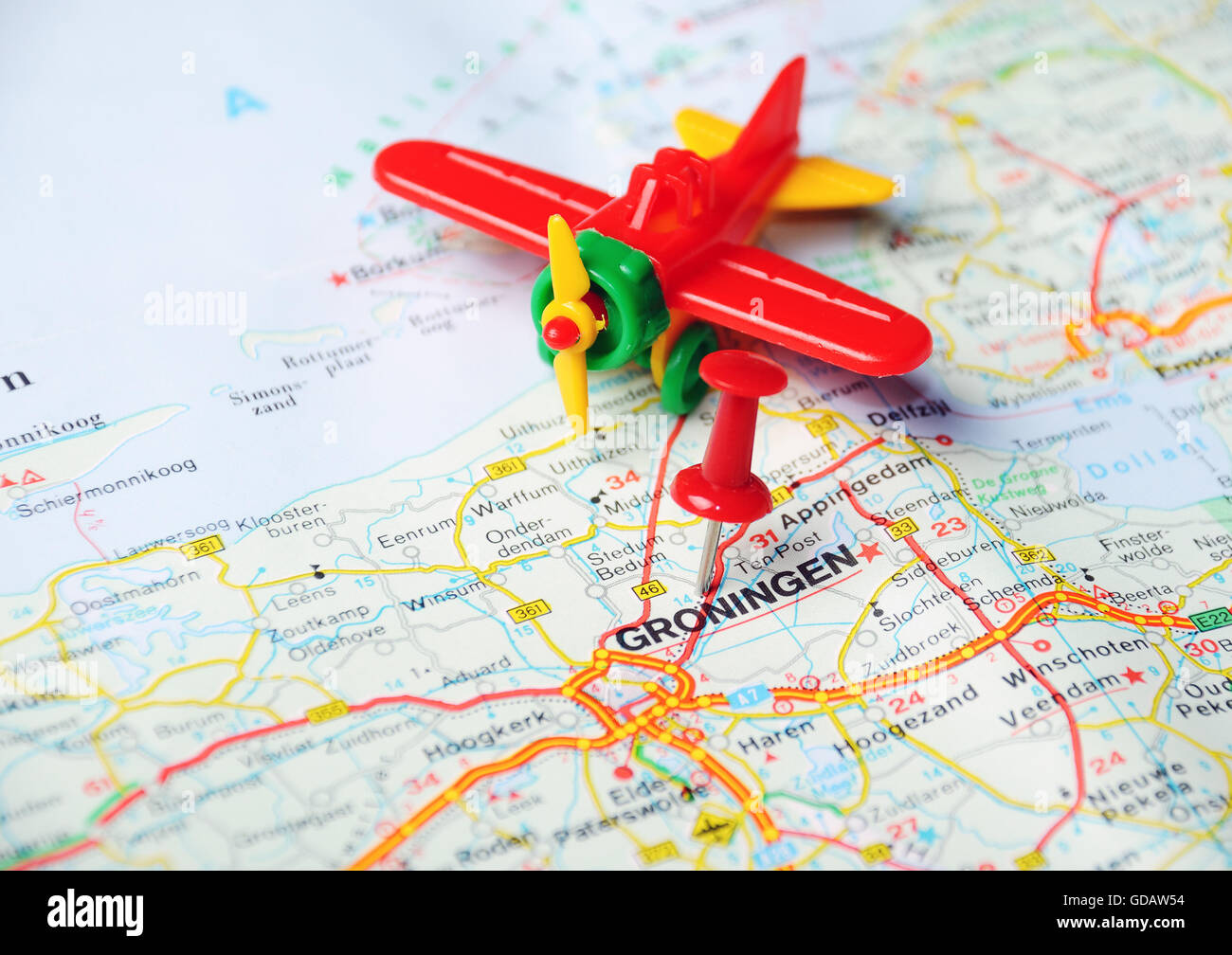Close up of Groningen , Netherlands map with red pin and airplane ...