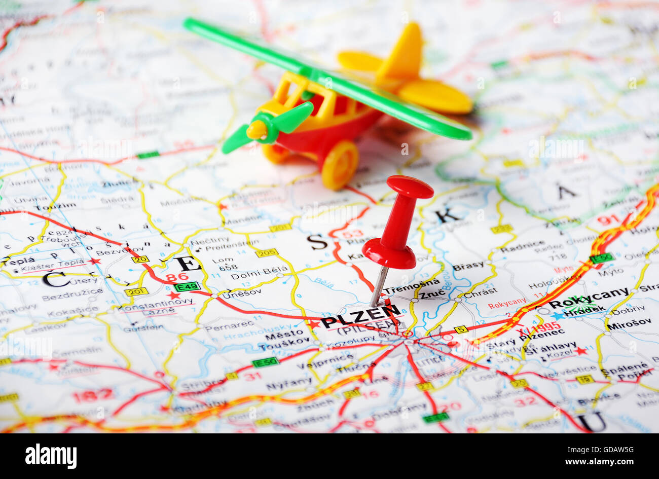Close up of Pilsen, Czech Republic map with red pin and airplane ...