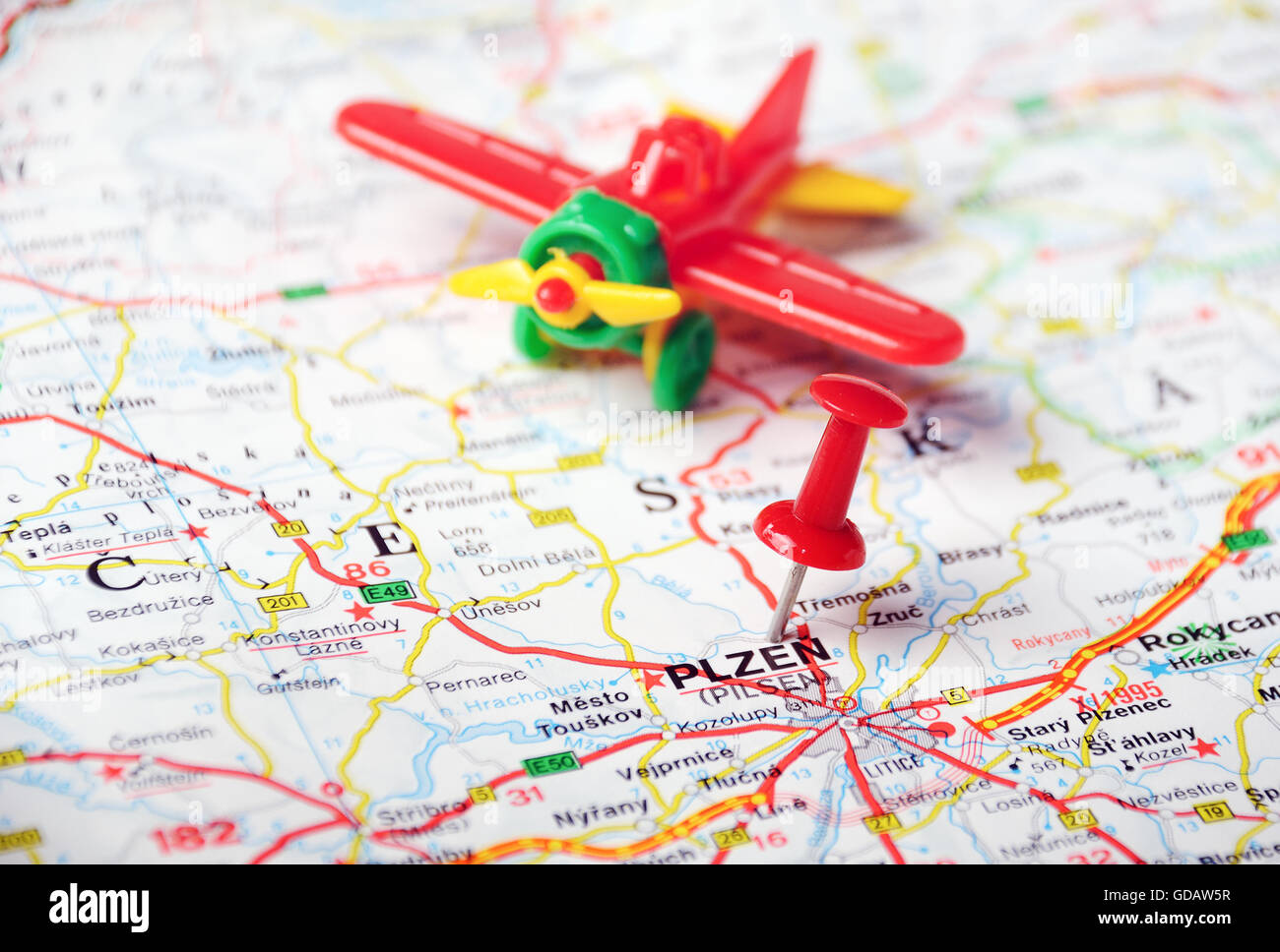 Close up of Pilsen, Czech Republic map with red pin and airplane ...
