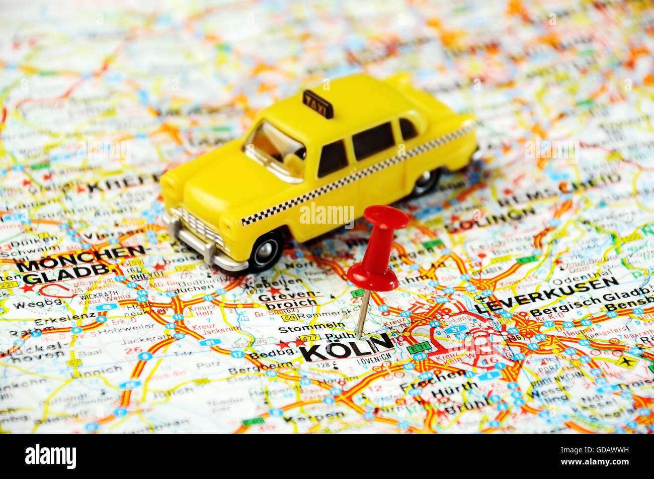 Red push pin pointing at Coln,Germany map and a taxi Stock Photo - Alamy