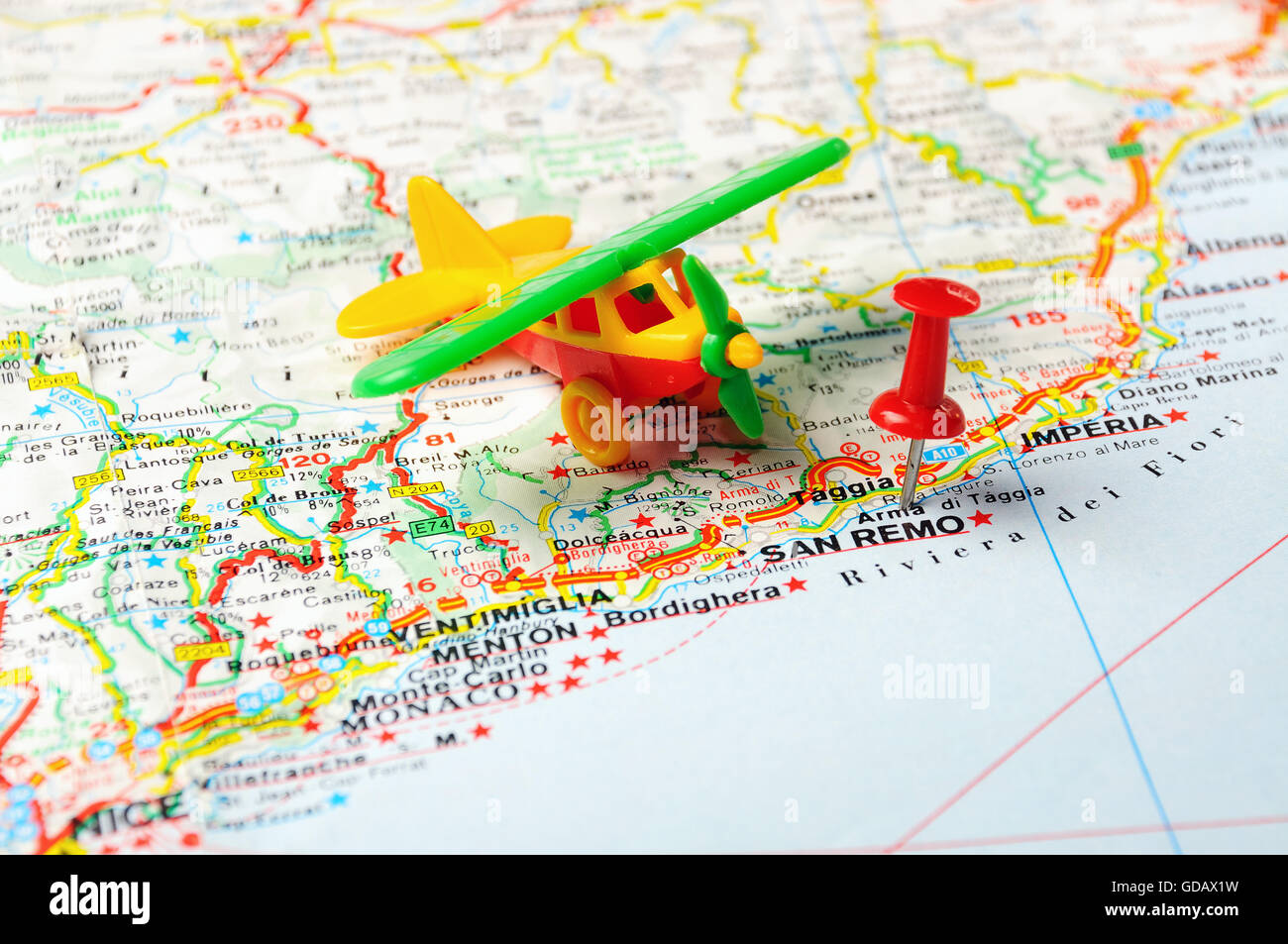 Red push pin pointing at San Remo map and airplane Stock Photo - Alamy